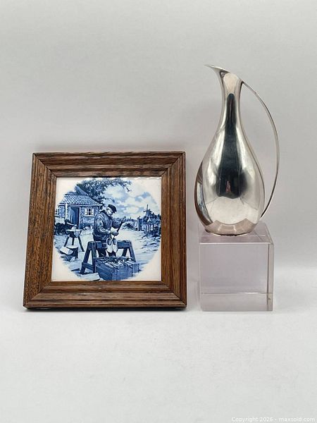 Henrik Fogh silver-plate pitcher & framed Delft-style tile | Maxsold