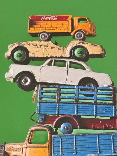 Signed Becca Wallace stacked toy cars photo | Maxsold