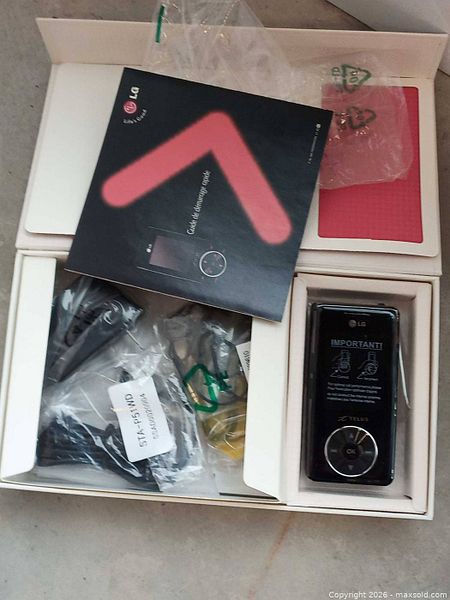 Vintage LG Telus feature phone in factory packaging | Maxsold