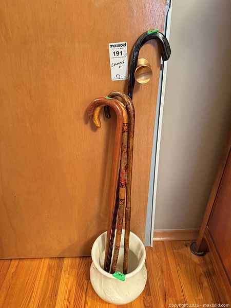 4 Wooden Walking Canes & Ceramic Stand | Maxsold