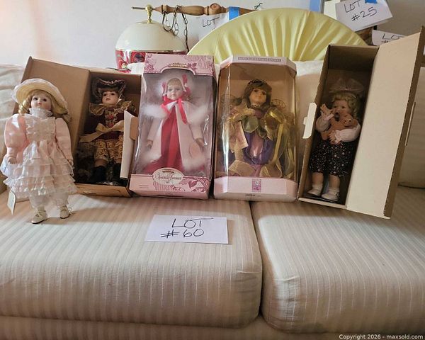 Set of five boxed porcelain dolls | Maxsold