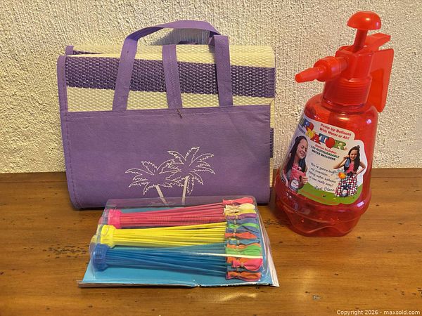 Pumpnator water balloon pump, refill stems and foldable beach mat | Maxsold
