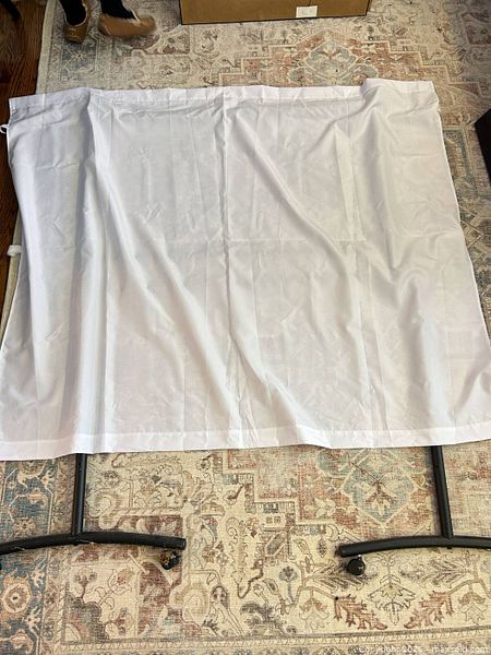 Portable photography backdrop stand with white white cloth | Maxsold