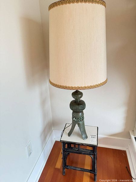 Asian-style verdigris metal table lamp and small rattan side table ...