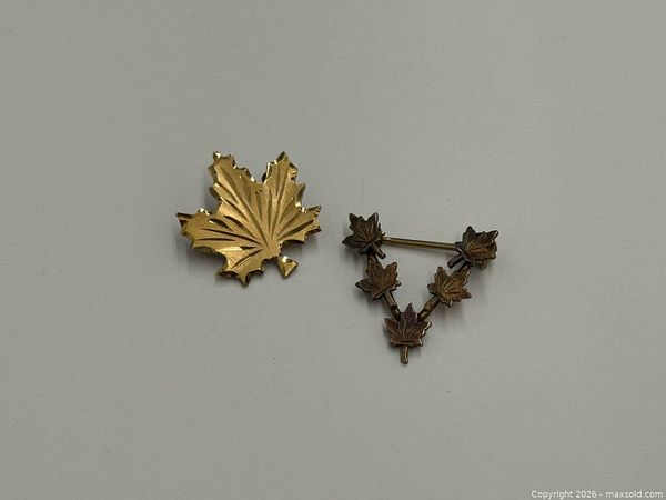 Pair of vintage 10K gold maple leaf pins | Maxsold
