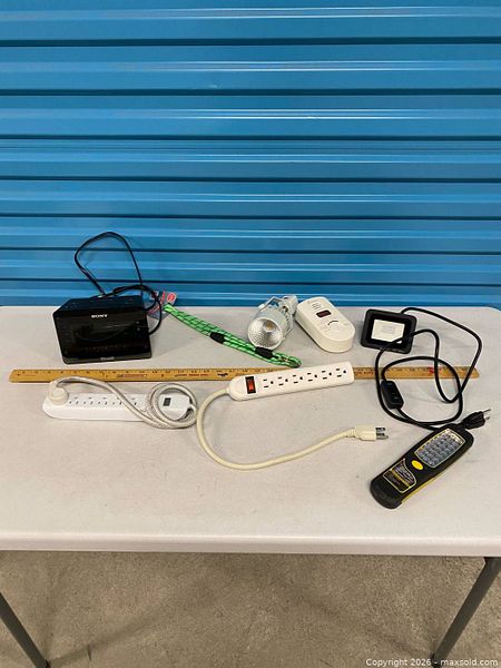 Sony Dream Machine, Kidde CO alarm, LED lights, power bars, cords | Maxsold