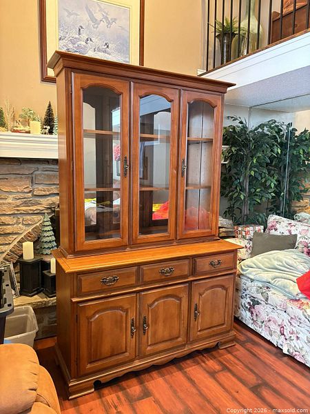 Solid maple buffet with hutch, glass doors, mirrored back | Maxsold