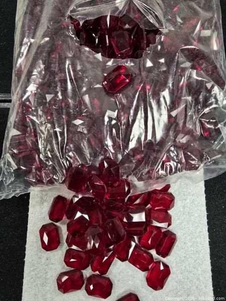 Red acrylic faceted gems bag | Maxsold