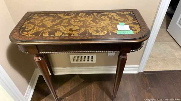 Glass inset console table | Maxsold