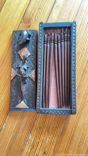 Hand-carved wooden box with eight wooden chopsticks | Maxsold