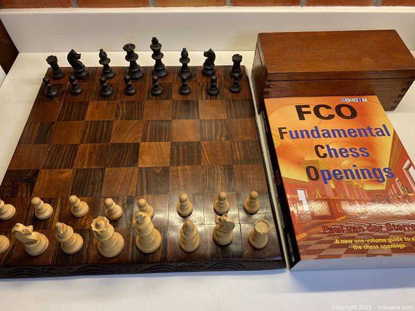 Wooden chess set and FCO openings book | Maxsold