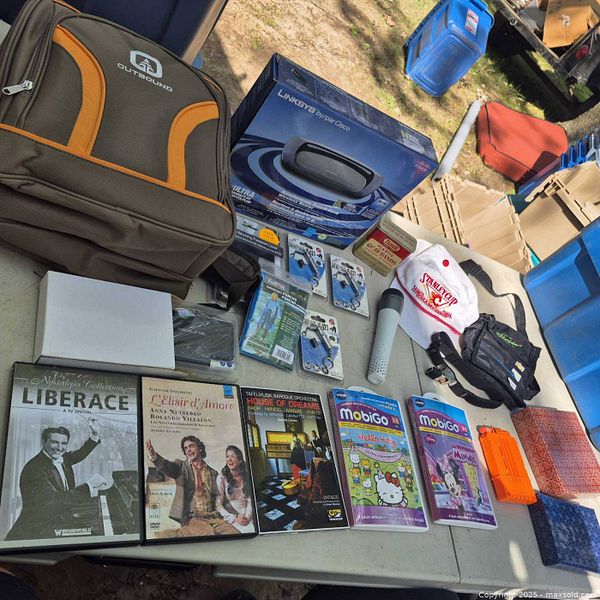 Linksys dual-band router, picnic kit, VTech MobiGo games, DVDs, hats ...