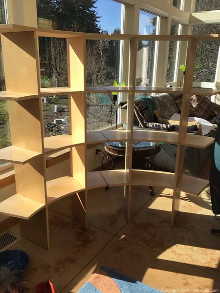 Pair light wood curved shelving units | Maxsold