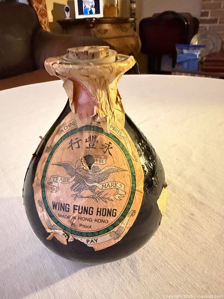 Vintage Wing Fung Hong 84-proof ceramic liquor bottle | Maxsold